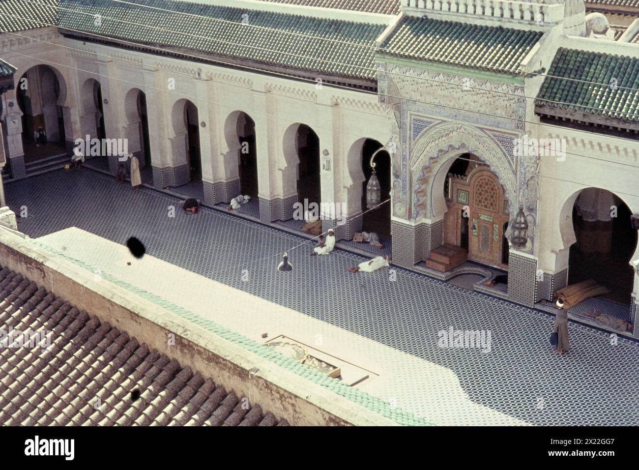 Praying Muslims in the courtyard of the Karauin Mosque in Fez ...
