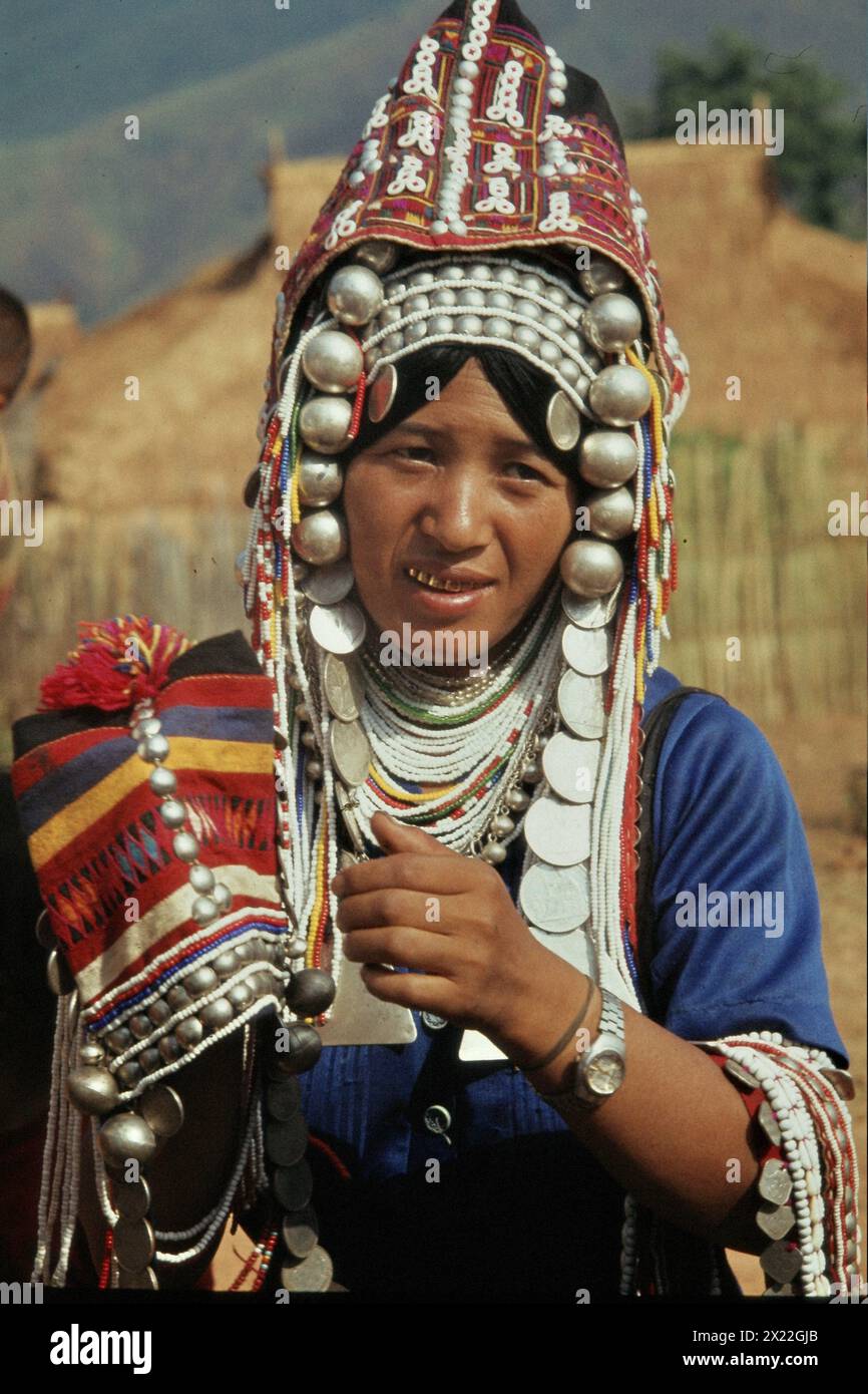 An woman of the ethnic group Meo (Hmong) in traditional dress with a ...