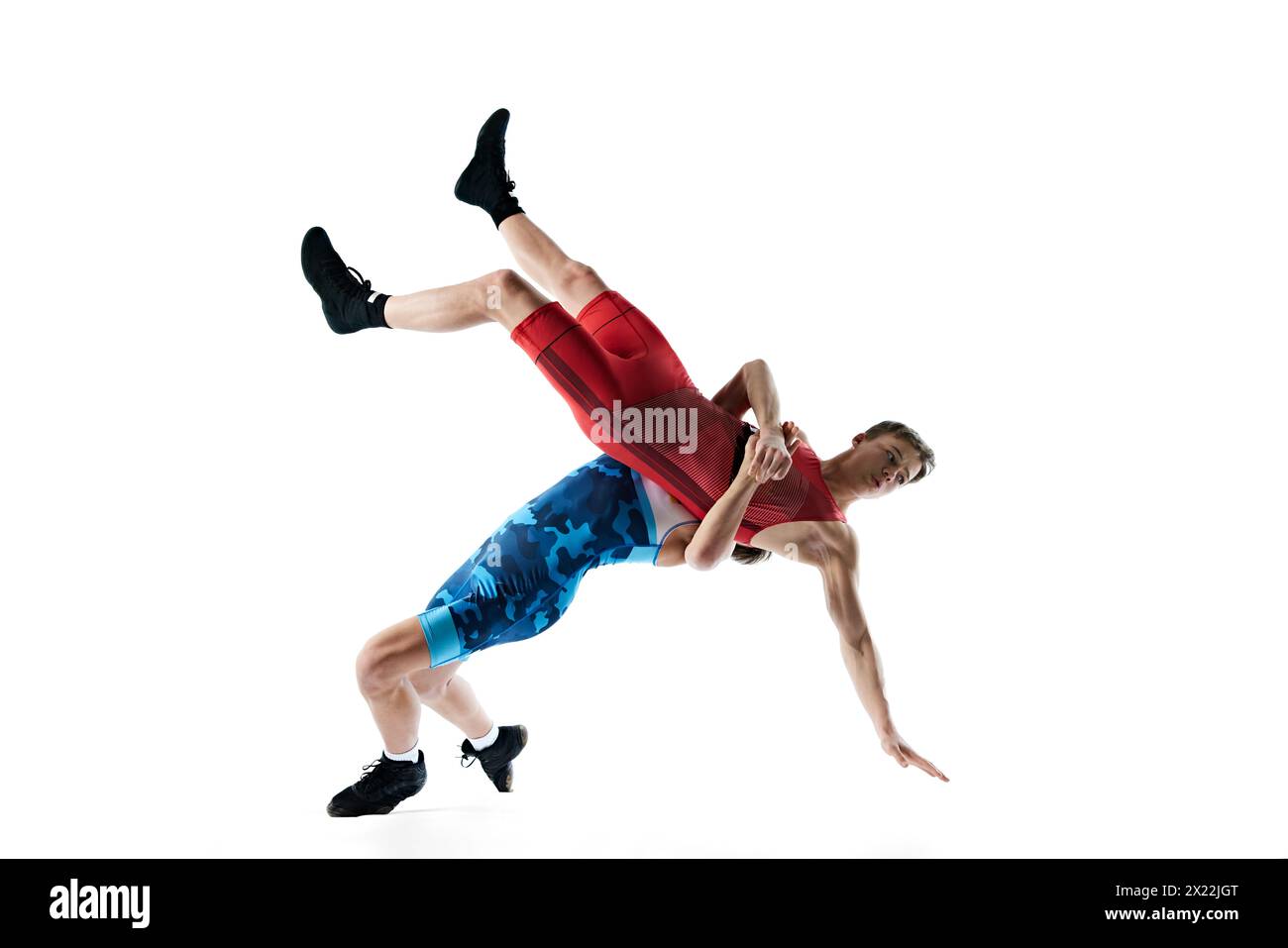 Two male athletes engage in wrestling match, grappling and striving for ...