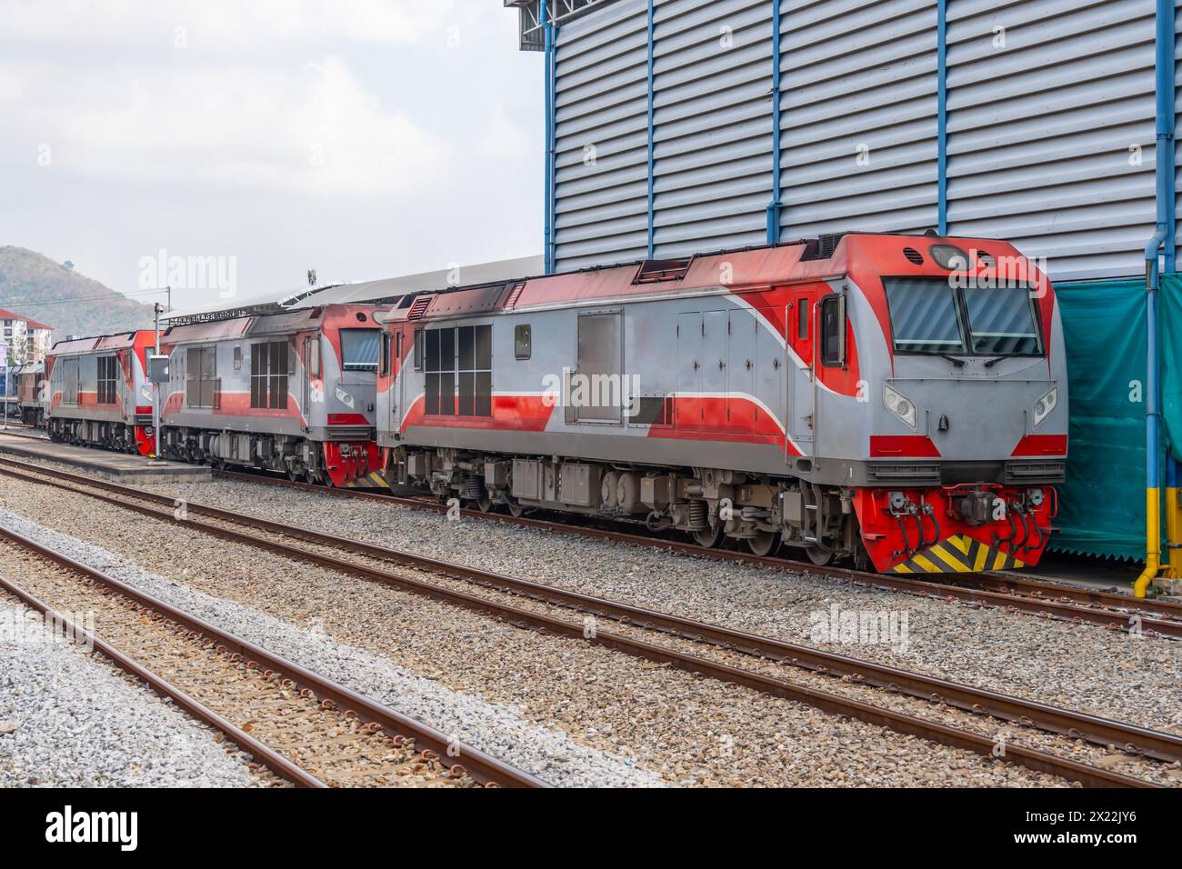 Head locomotive side view of the station platform and commuter train in ...