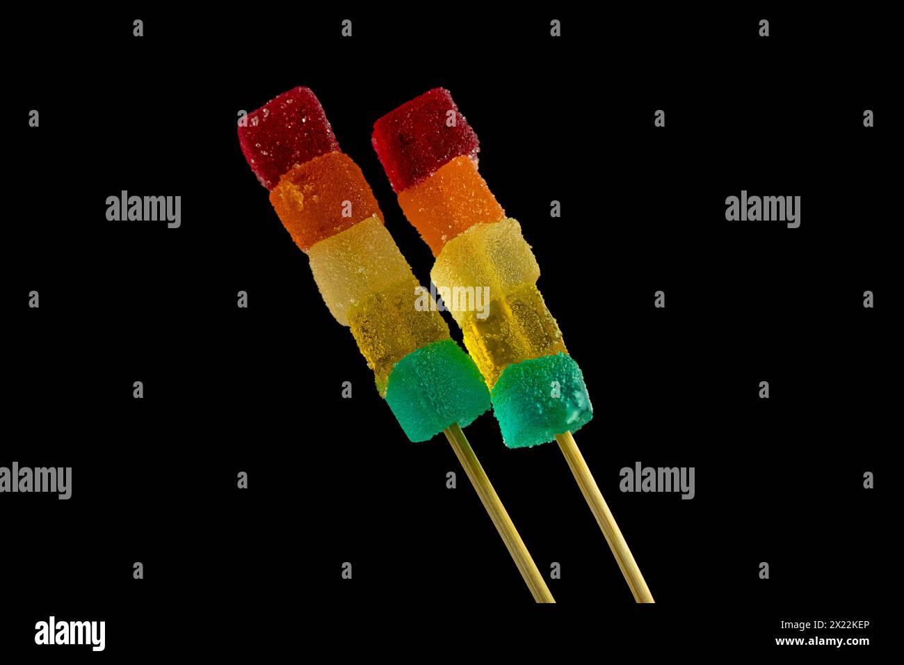 Two mix colour jelly lollipop in black background Stock Photo - Alamy