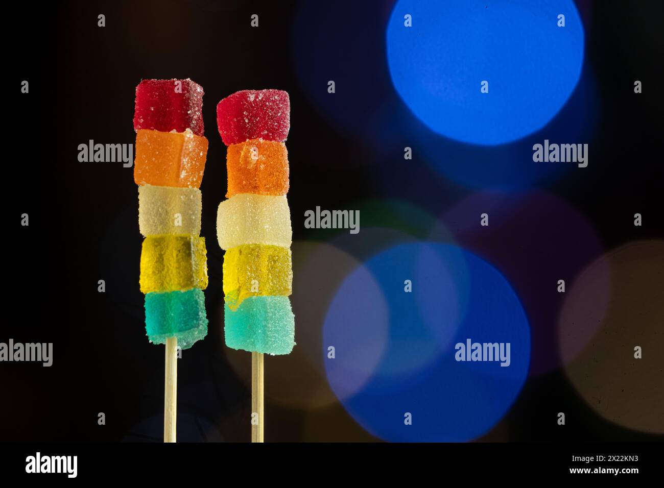 Mix colour jelly lollipop in blue ring background Stock Photo - Alamy
