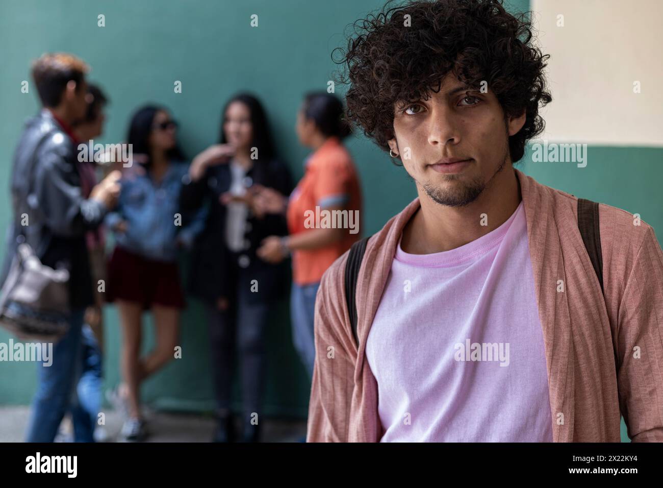 Group of young Latin American university students gathered outside ...