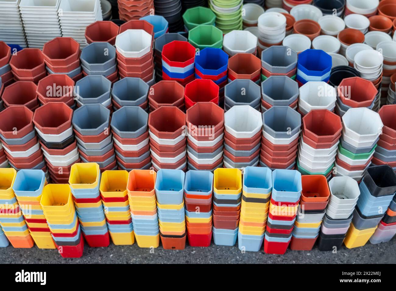 Many different shapes, round, square and color plastic pots for growing ...