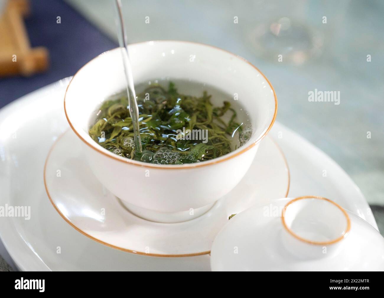 Beijing, China. 19th Apr, 2024. A tea sommelier serves tea for visitors ...