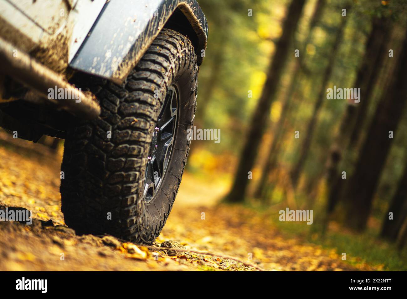 Off Road Driving Automotive Theme. SUV Wheel Close Up. Countryside Road ...