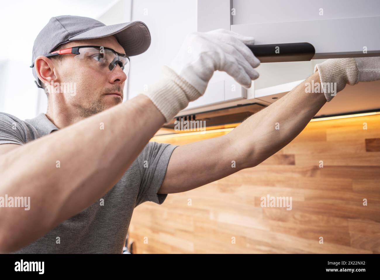 Cabinetmaker Assembling Kitchen Cabinets. Modern Clean White Furniture ...