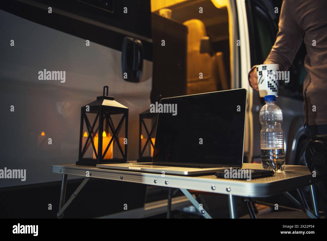 Campsite Remote Online Work. Modern Laptop Computer on a Camping Table ...