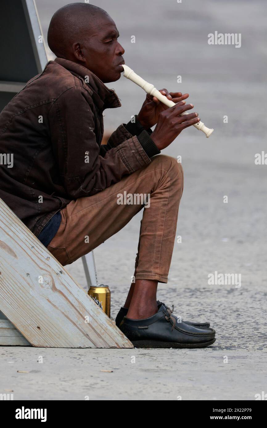 Flute player busking at Hout Bay harbour, Cape Town, South Africa Stock ...