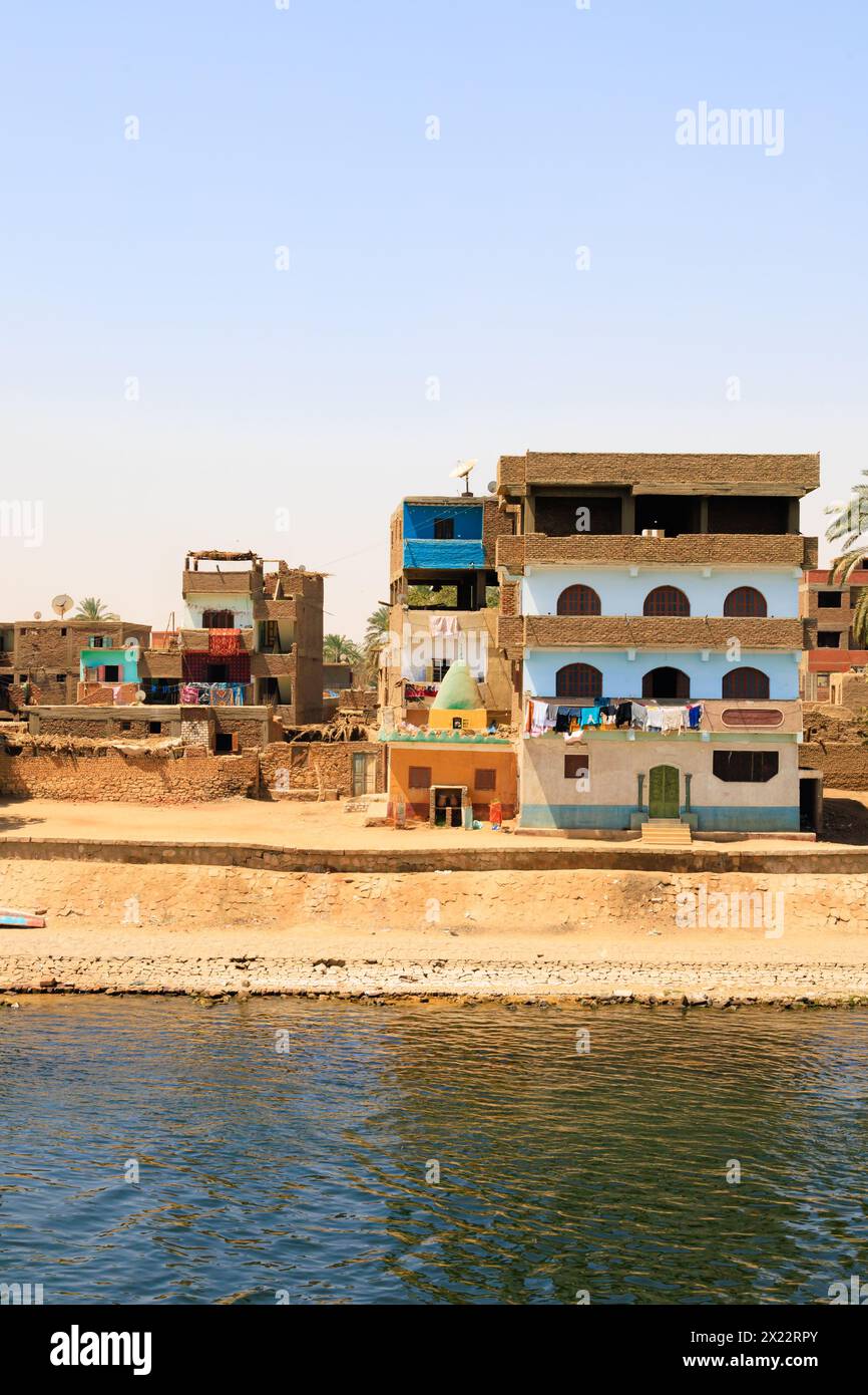 Colourful houses on the banks of the River nile between Luxor and Aswan ...