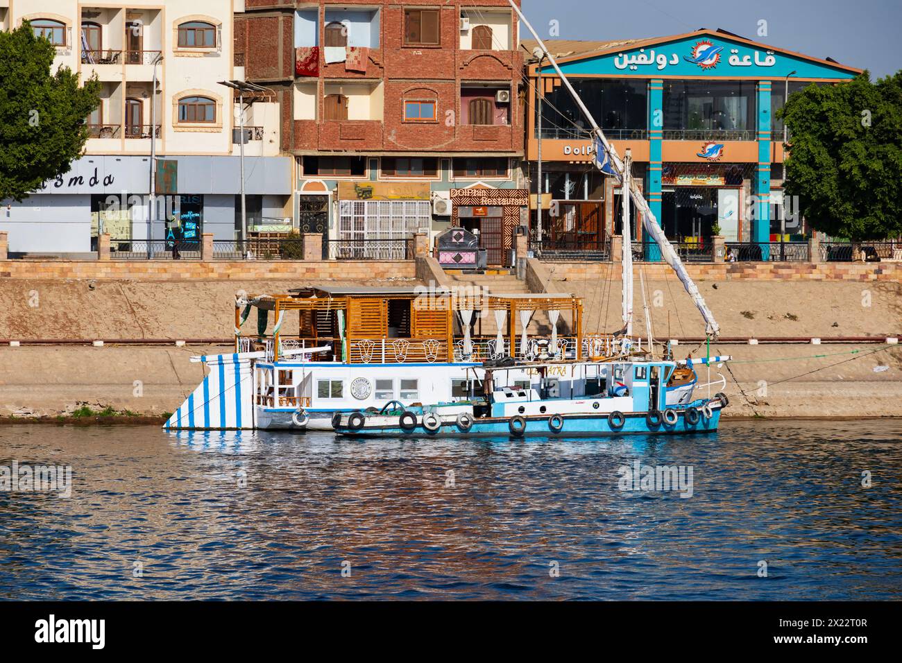 Tugboat and sailing barge boat, moored near Kom Ombo, River nile ...