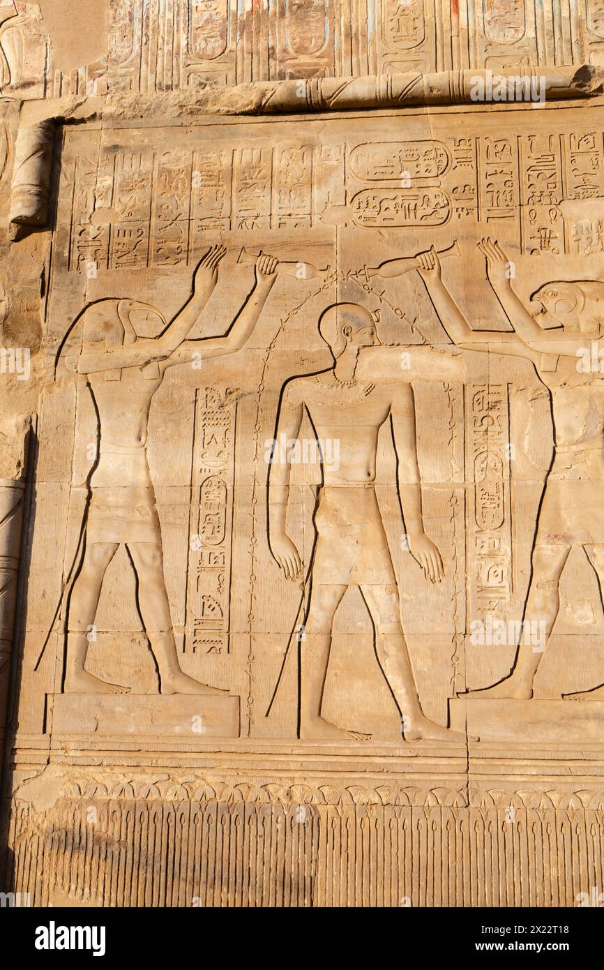 Relief carving of The Gods Horus and Thoth pouring liquid over ?? The ...