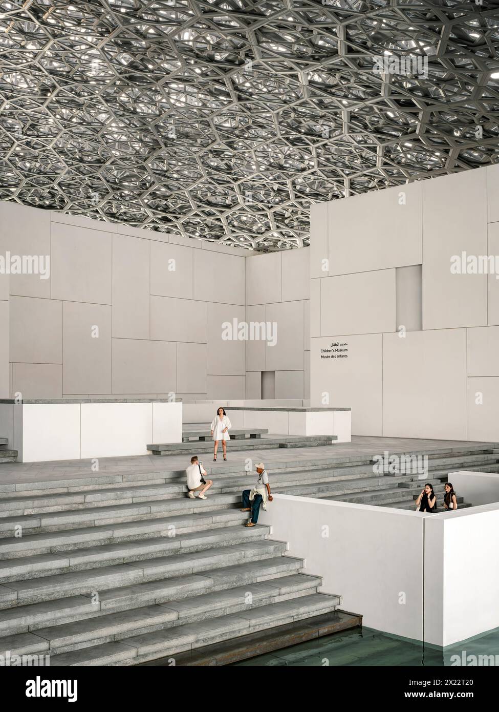 Dome and cube-like structures with stairway to water. Louvre Abu Dhabi ...