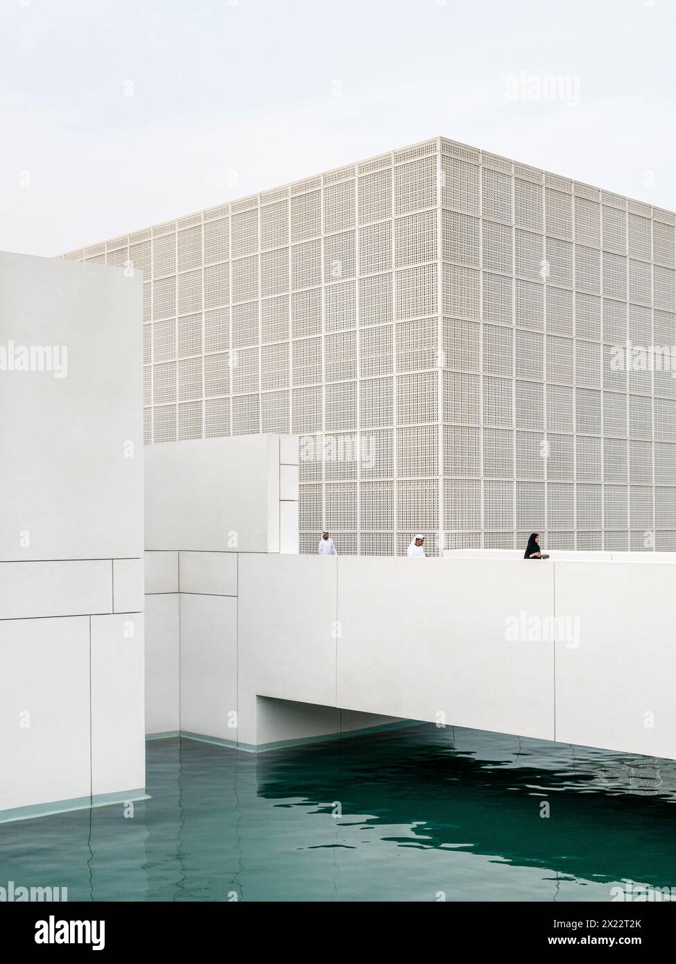 Cube-like structures with bridge crossing water features. Louvre Abu ...