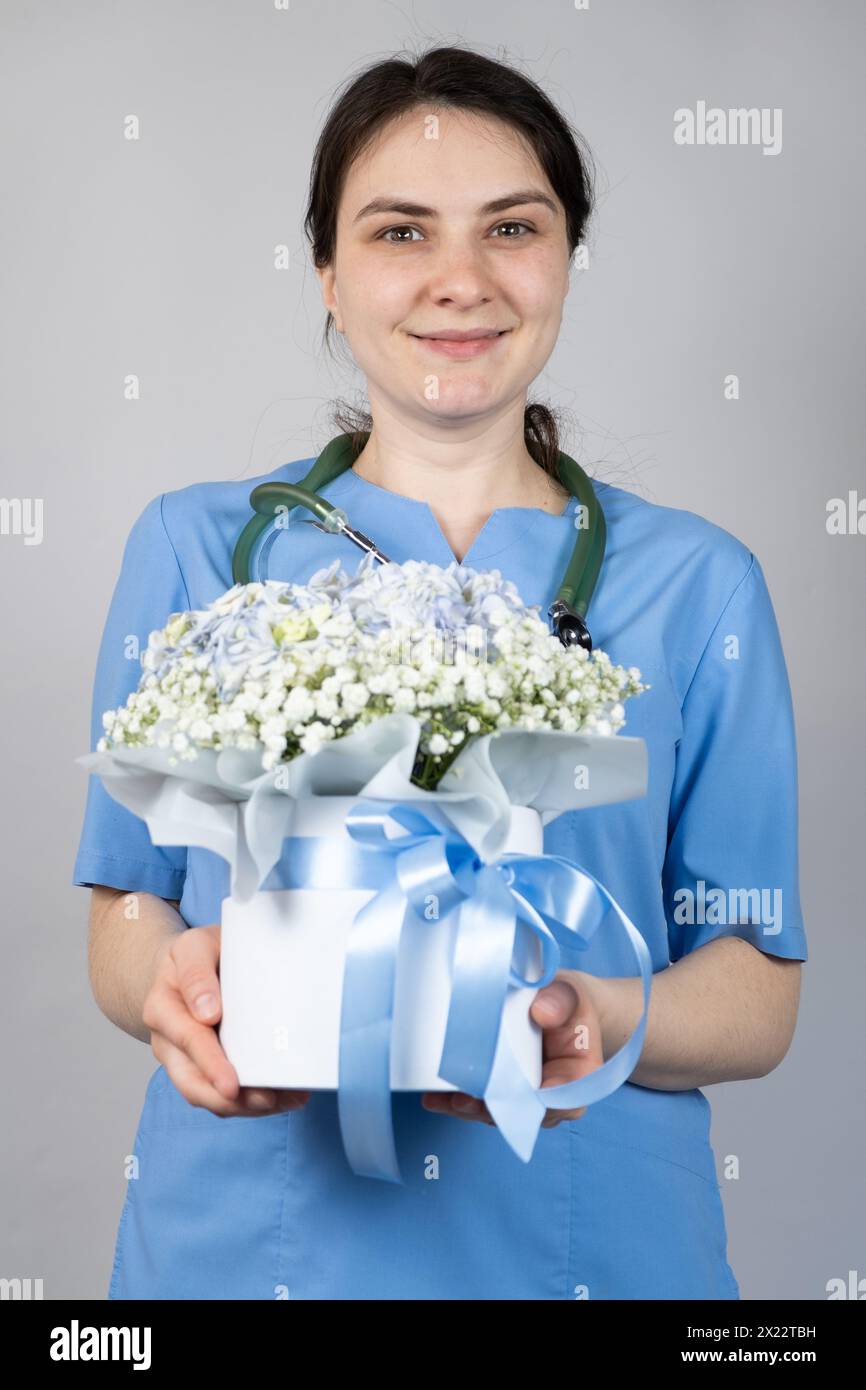 Doctor cardiologist therapist holds heart hi-res stock photography and ...