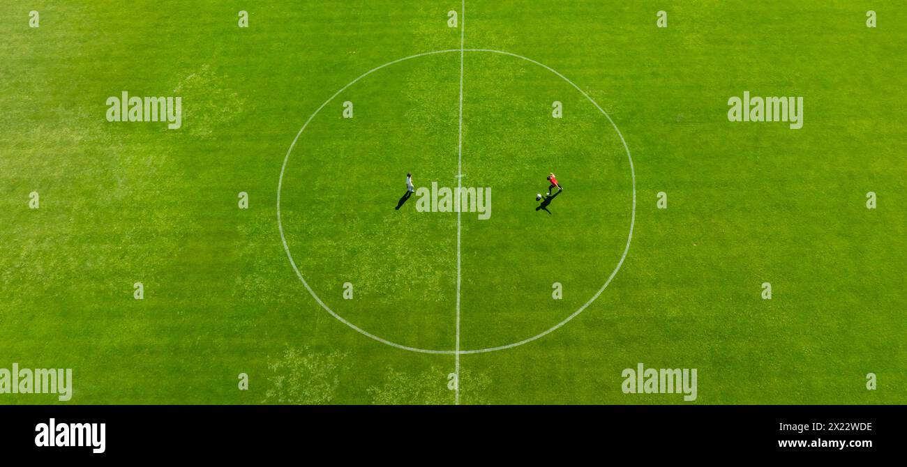 football in the middle of the football field Stock Photo - Alamy