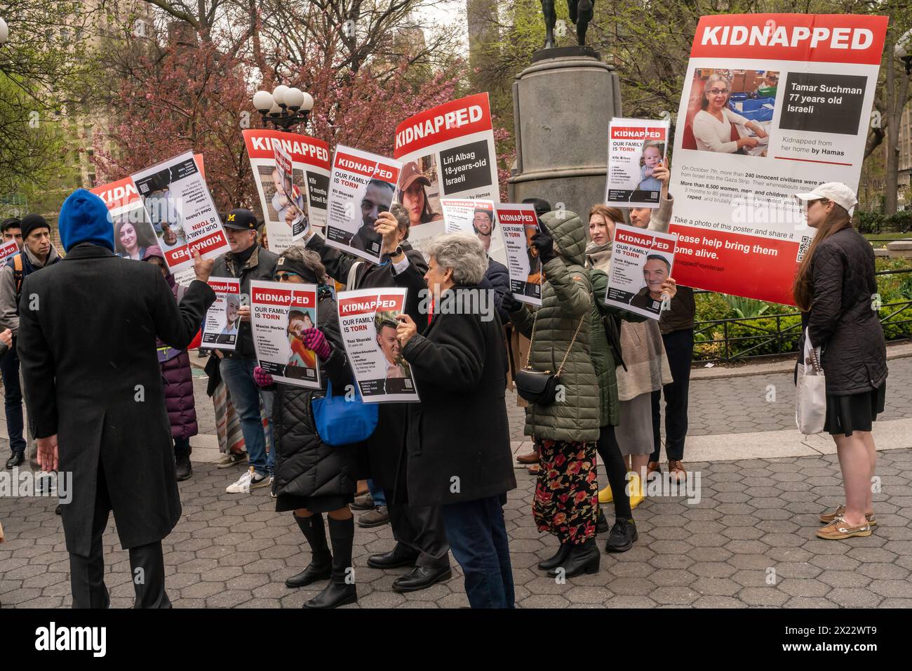 Protesters calling for the release of the hostages held by Hamas carry ...