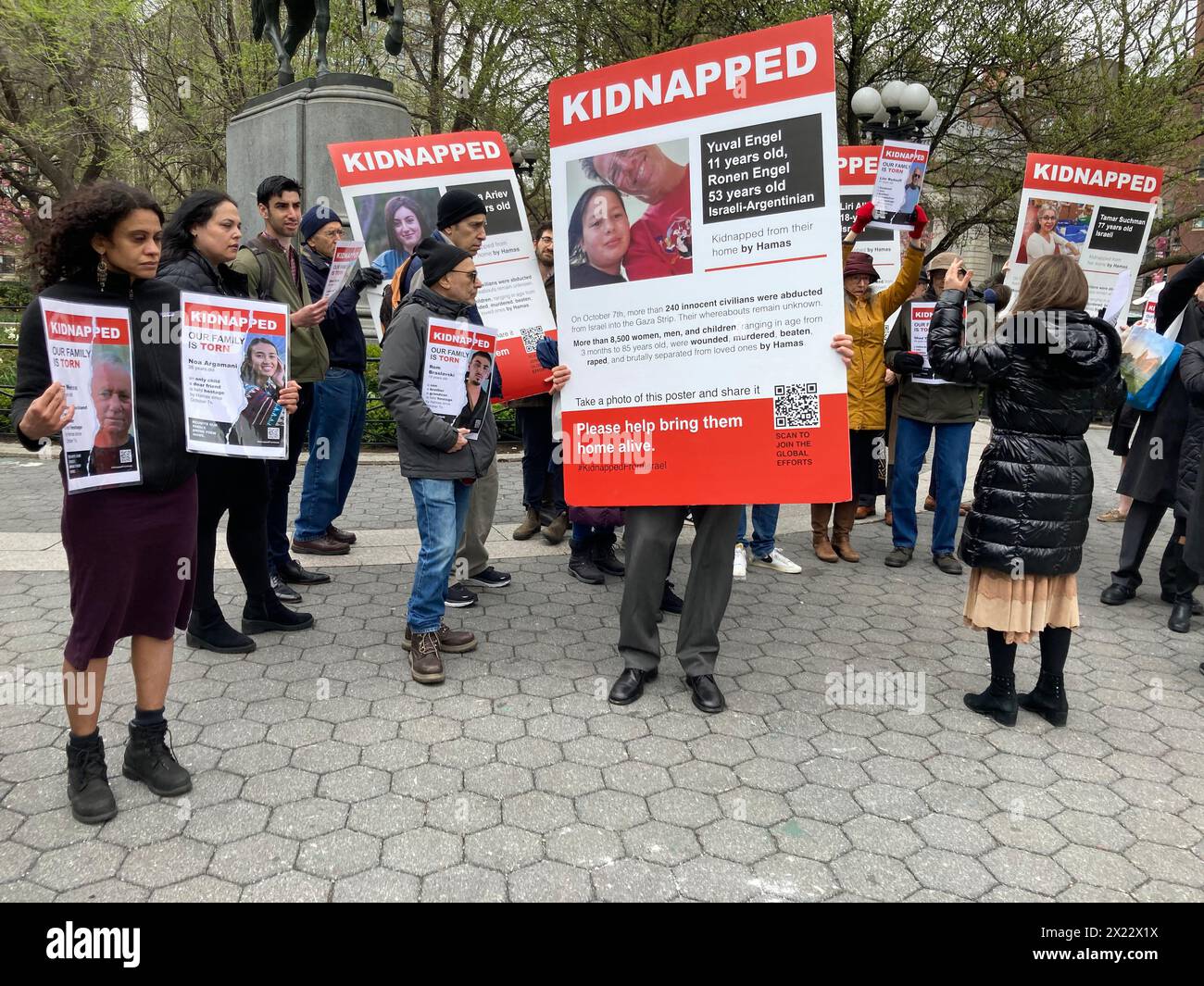 Protesters calling for the release of the hostages held by Hamas carry ...