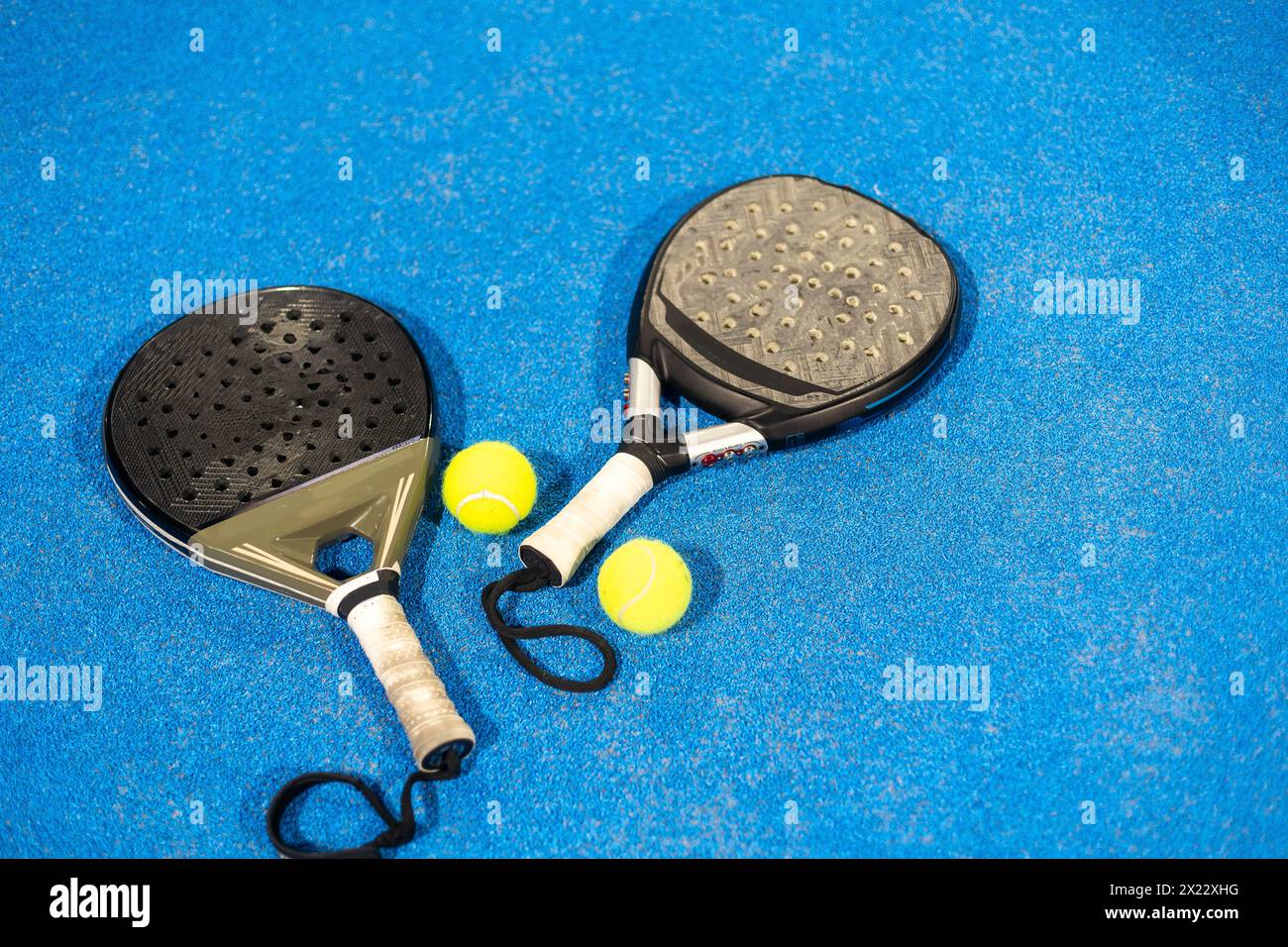 Padel tennis racket. Background with copy space. Sport court and balls ...