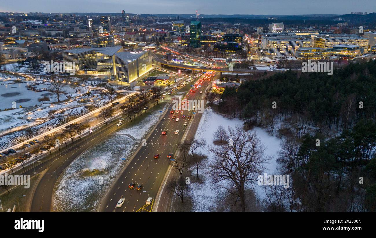 Drone photography of main street going through city covered by snow ...