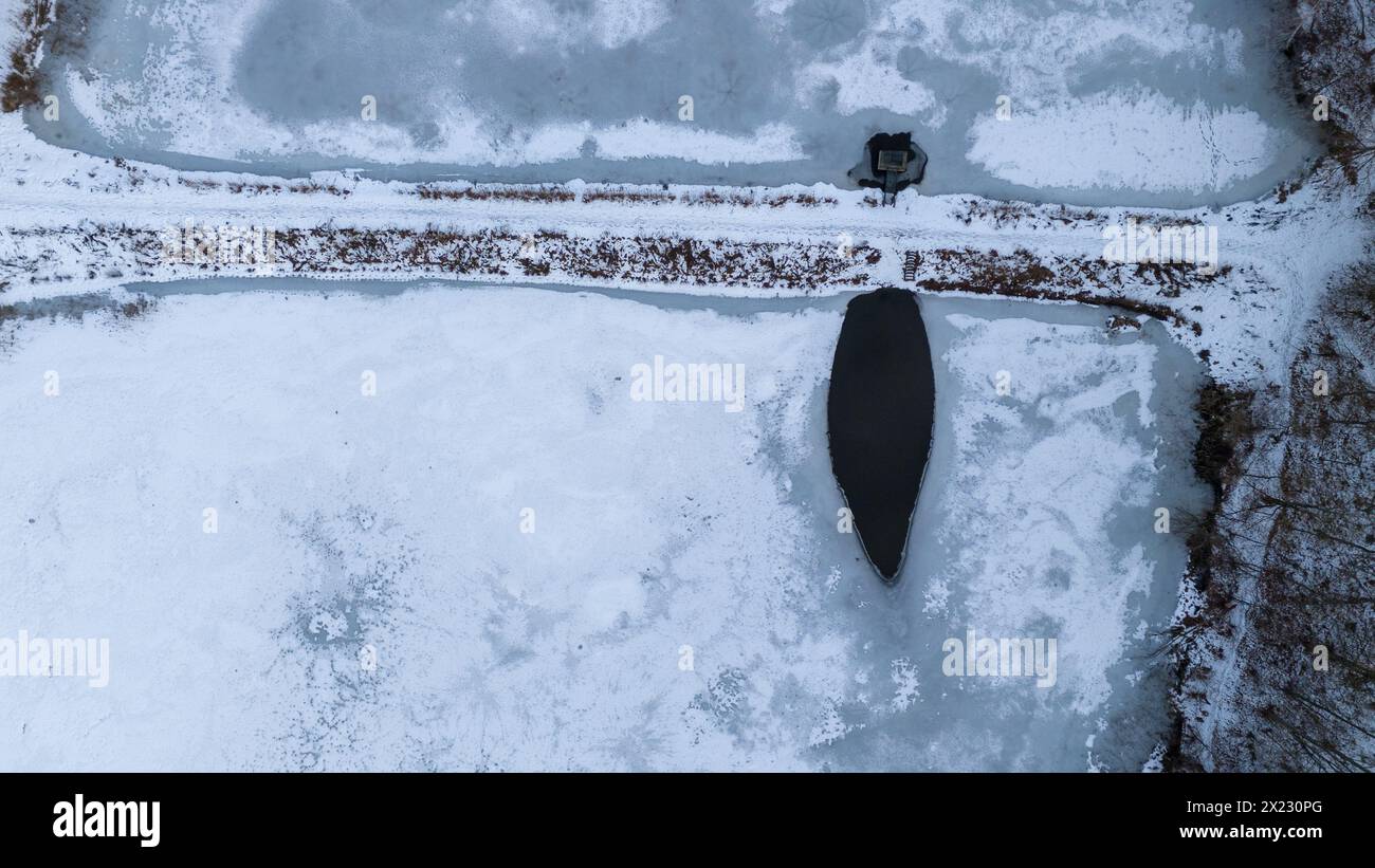 Drone photography of iced up lake and road going through it during ...