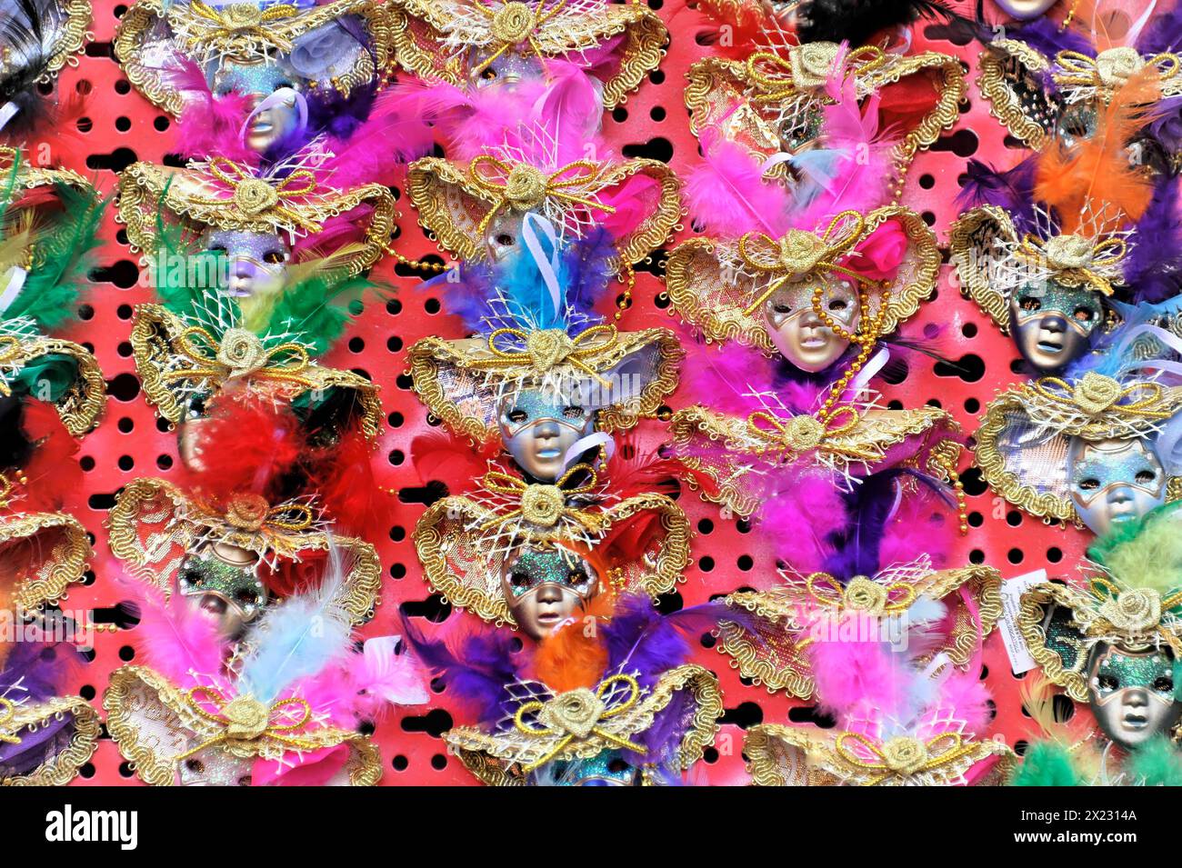 Colourful carnival masks with feather decorations present the lively ...