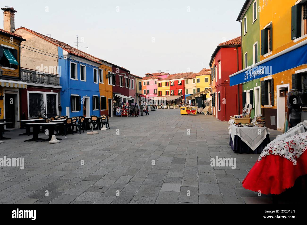 Colourful houses, Burano, Burano Island, Lively shopping street with market stalls and colourful ...