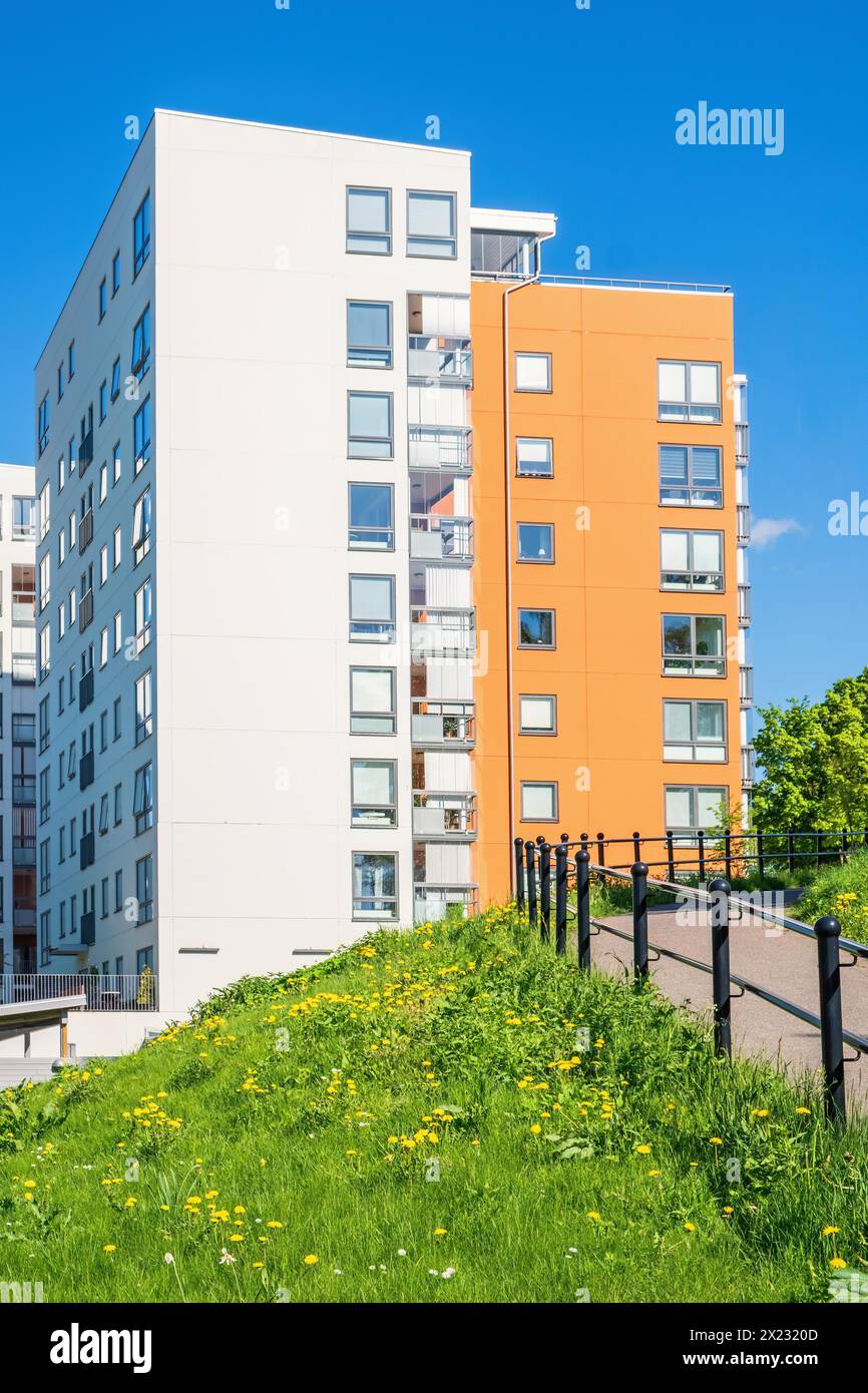 High-rise buildings with apartments in a city and a footpath in the ...