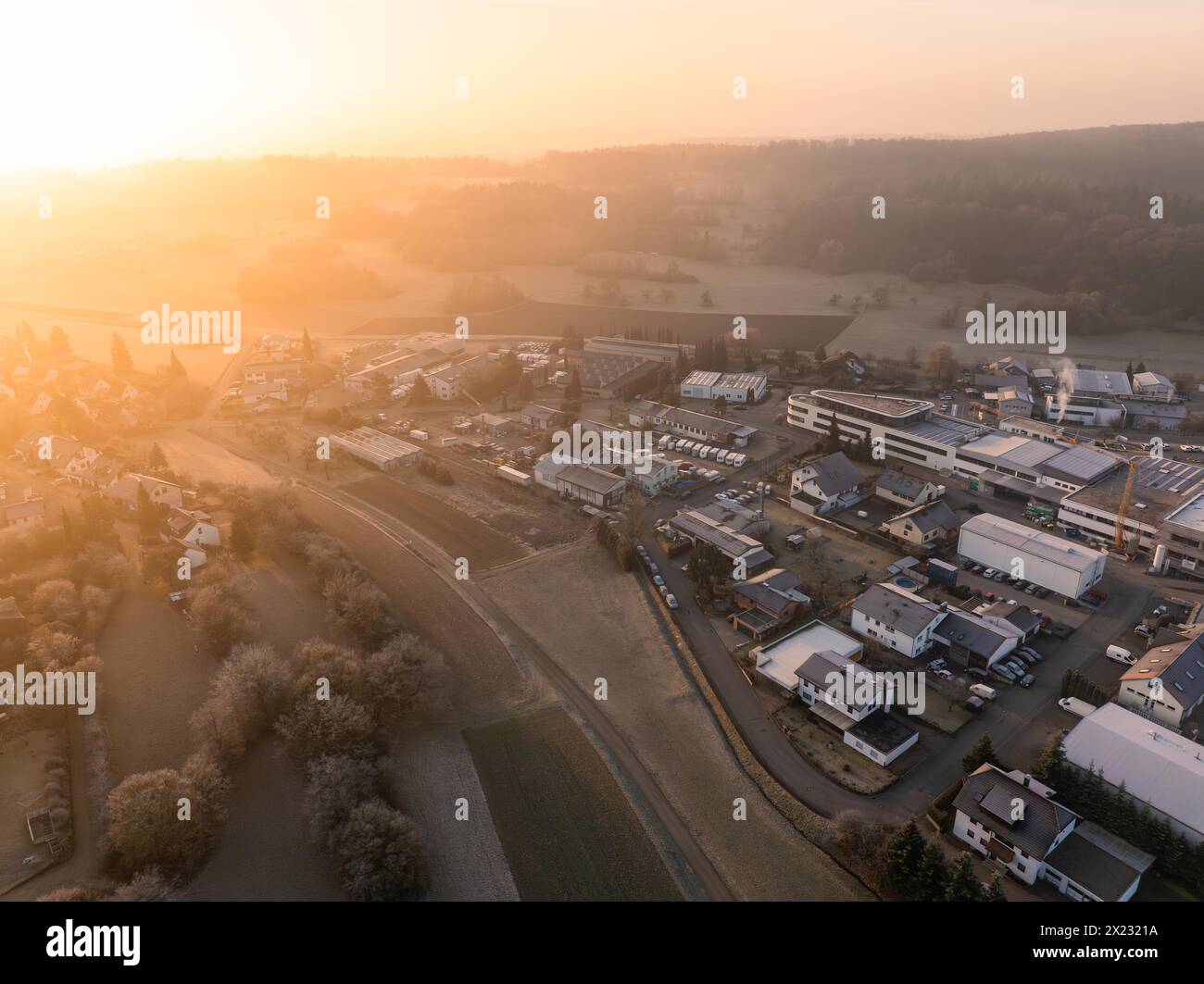 Morning light sweeps over an industrial estate and casts long shadows ...