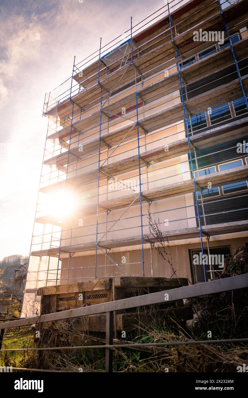 Scaffolding in front of a new building with a half-timbered house in ...