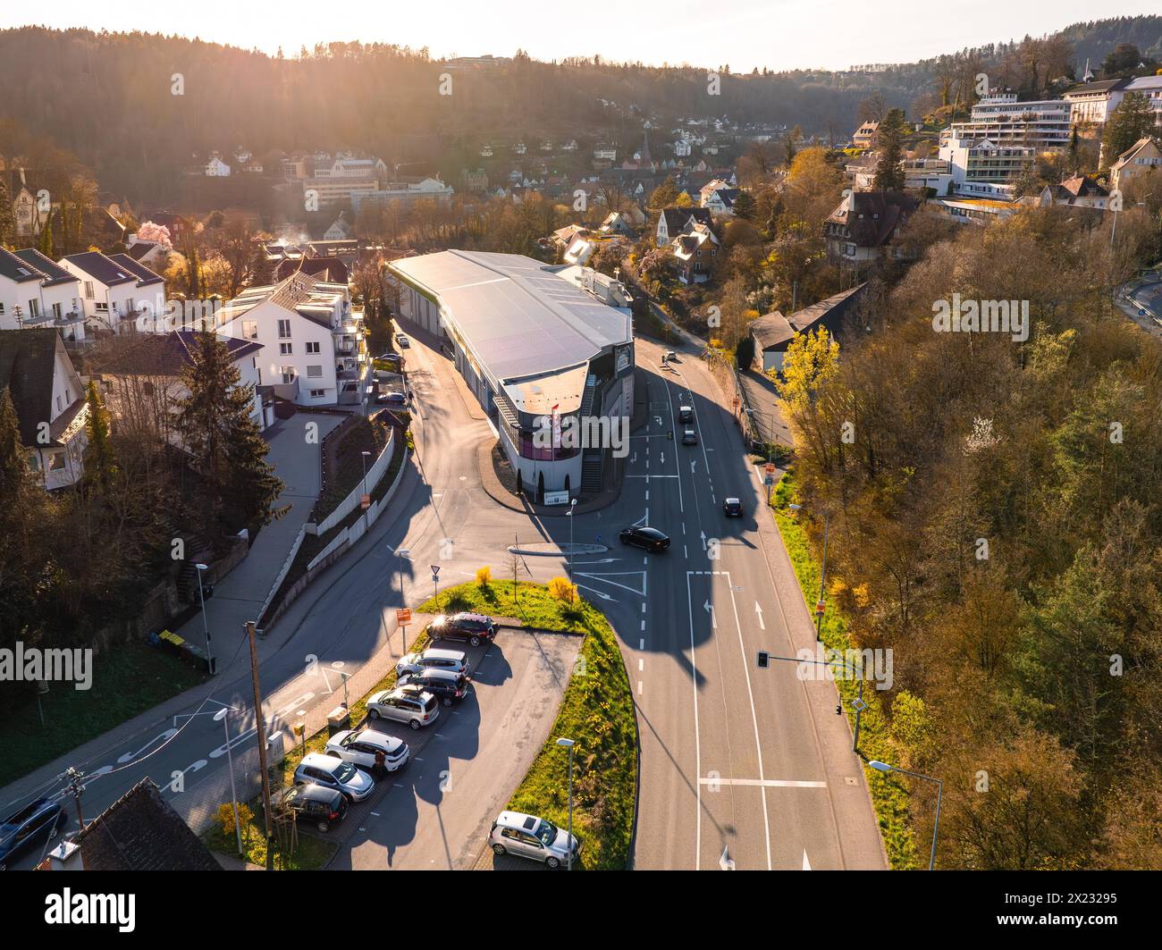 Drone view of a large commercial building surrounded by streets and ...