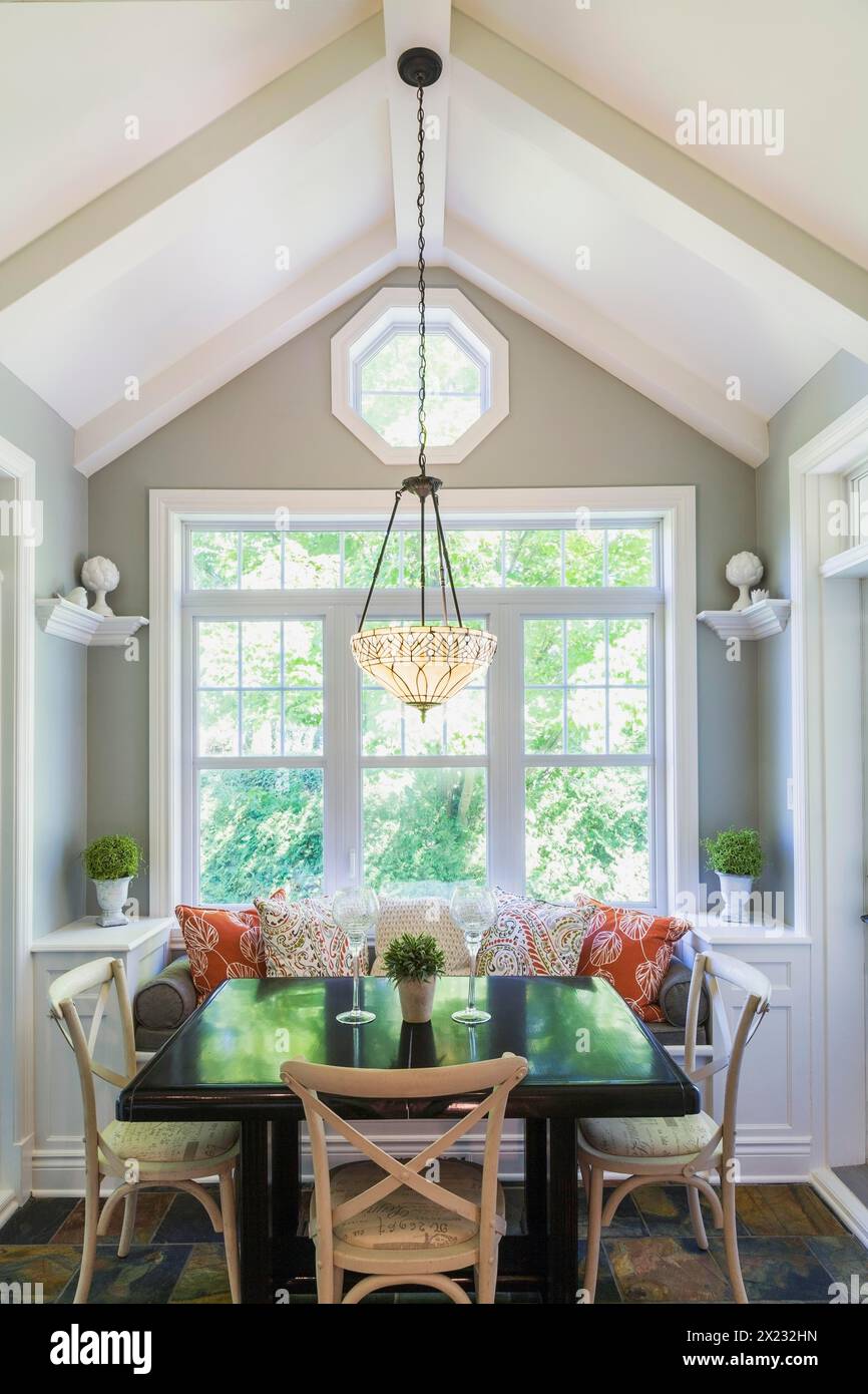 Wooden breakfast table with sitting bench and chairs in the kitchen ...