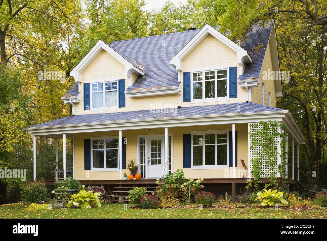 Yellow Two Story House What Is A Craftsman House? | Angi