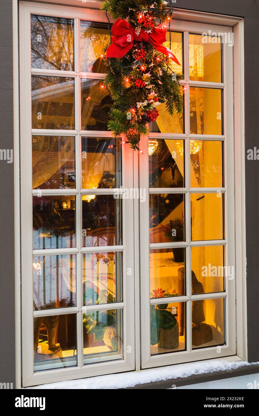 Brown and beige window with illuminated Christmas lights and ...