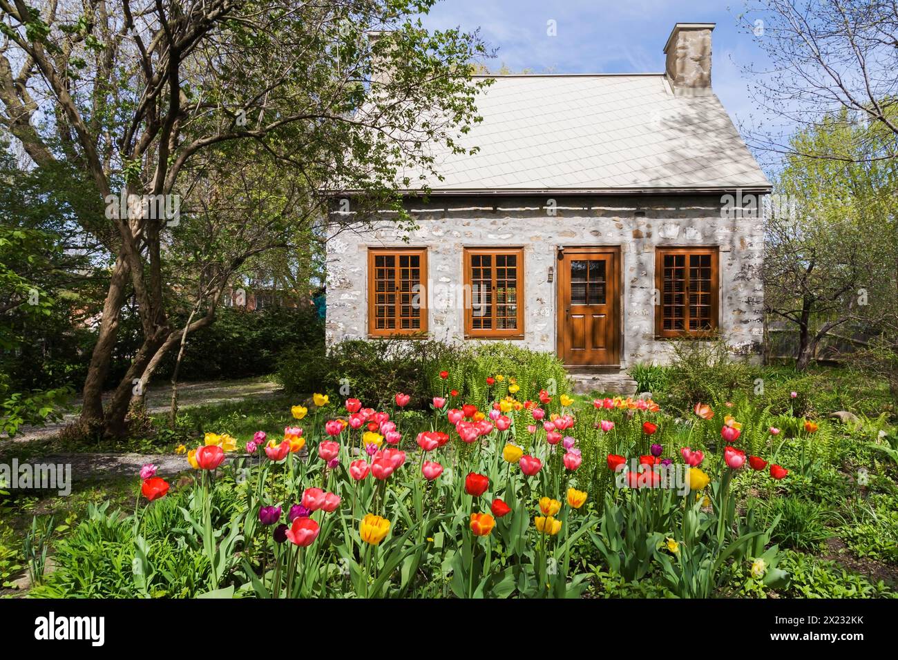 Old circa 1750 Canadiana style fieldstone house facade with brown ...