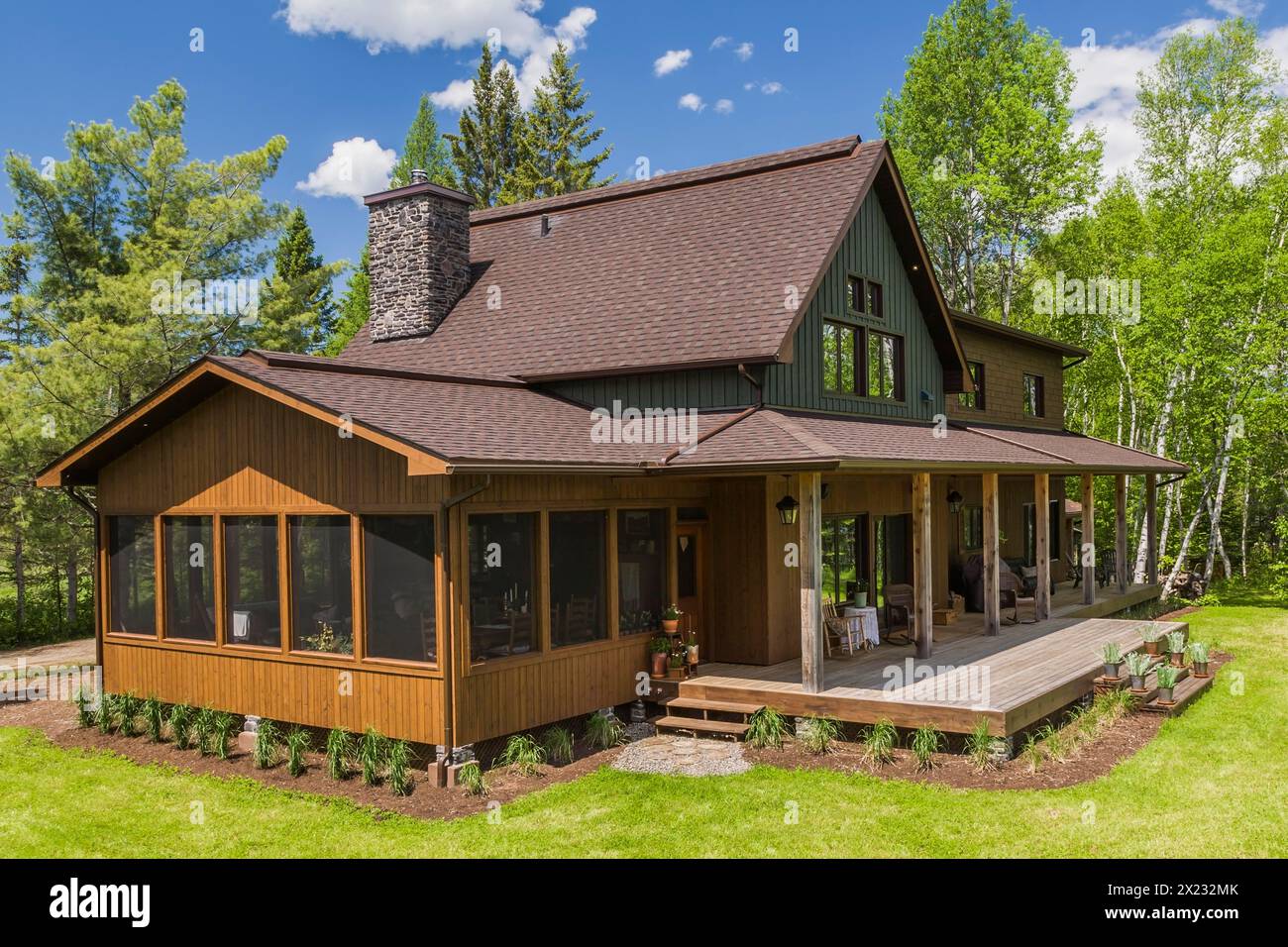 Elevated rear view of brown and green stained spruce wood and cedar ...