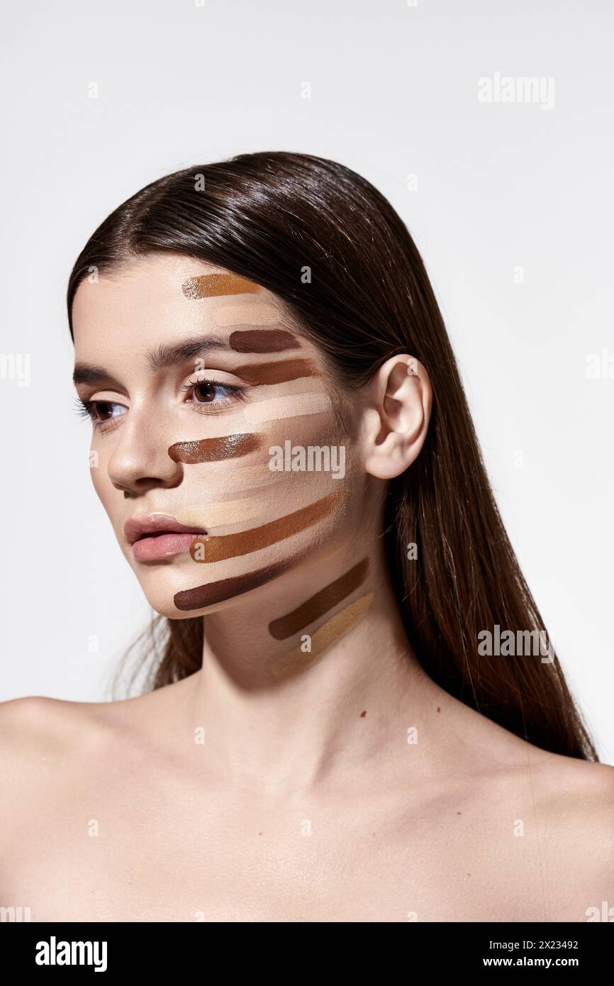 A beautiful young woman with makeup on her face, showcasing her ...