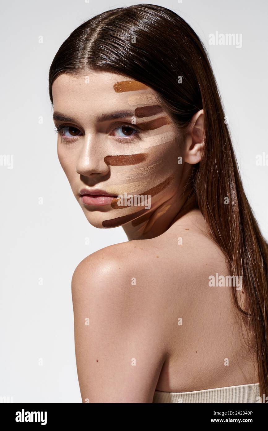 Alluring woman showcases her beauty with makeup on her face, including ...