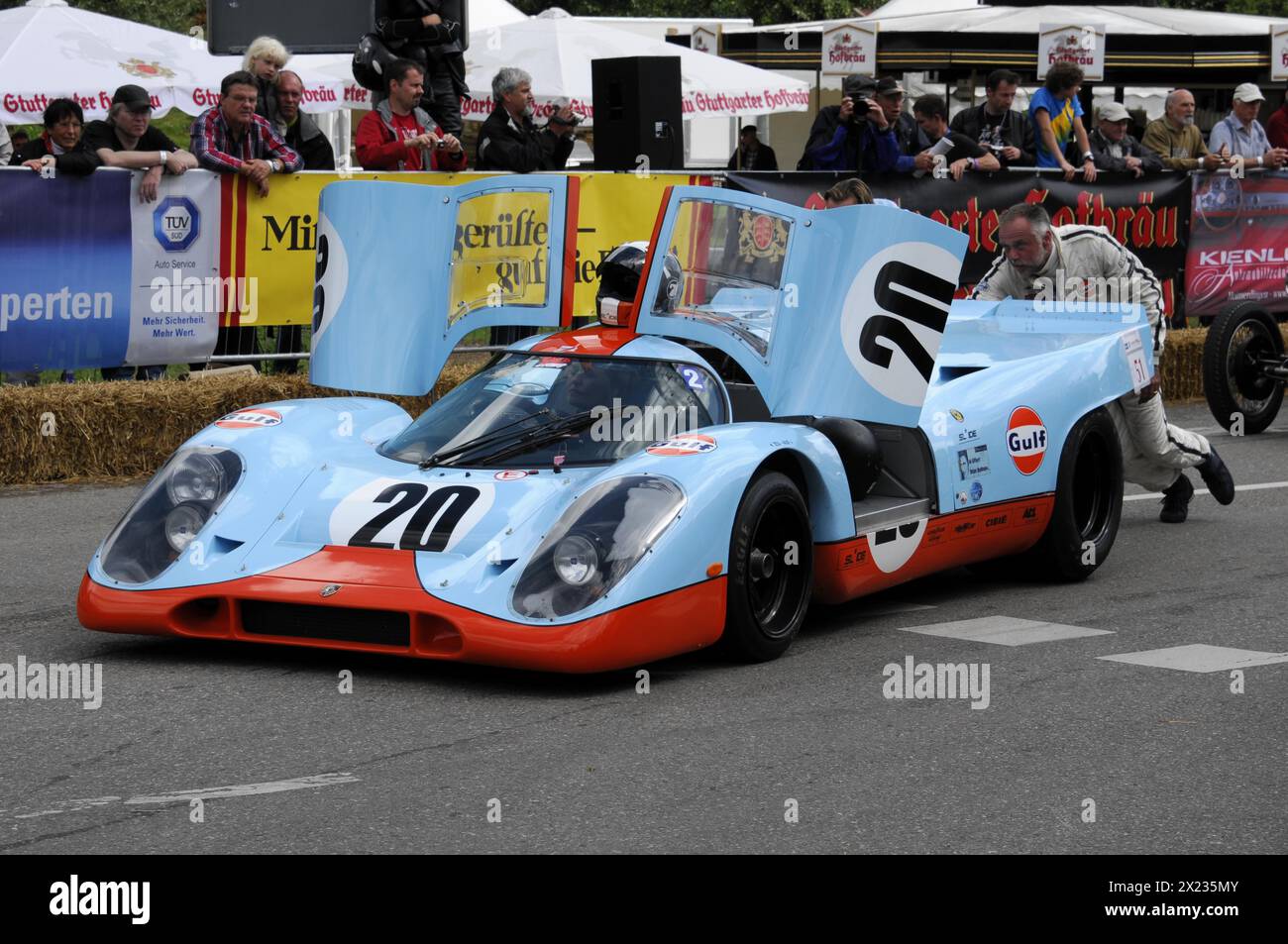 The Gulf racing car with the number 20 is presented at a racing event ...