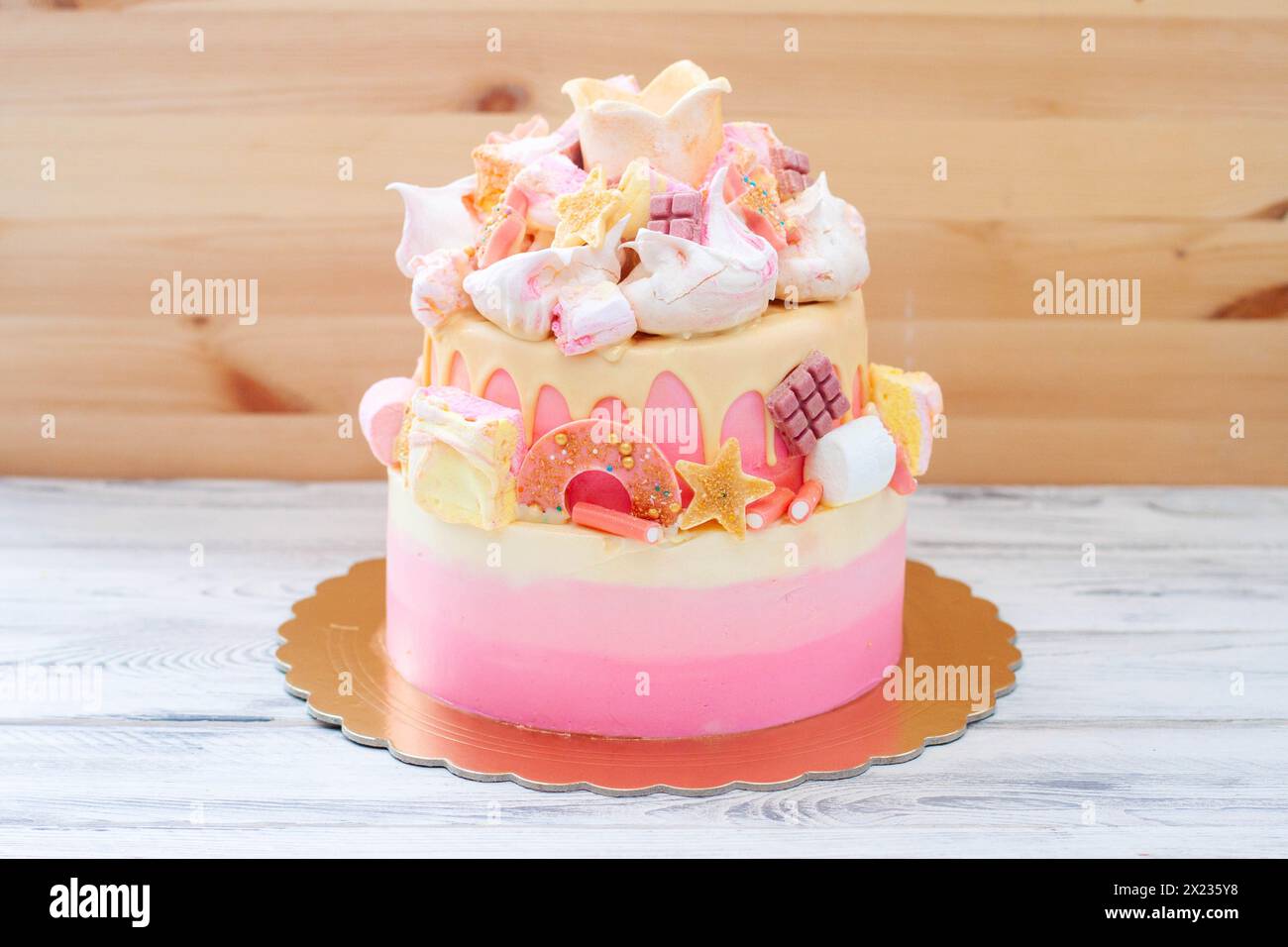 Gradient layered pink birthday cake with meringue clouds, chocolate ...