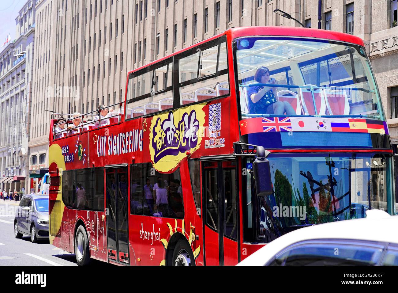 Shanghai, Sightseeing double-decker bus with colourful design drives ...