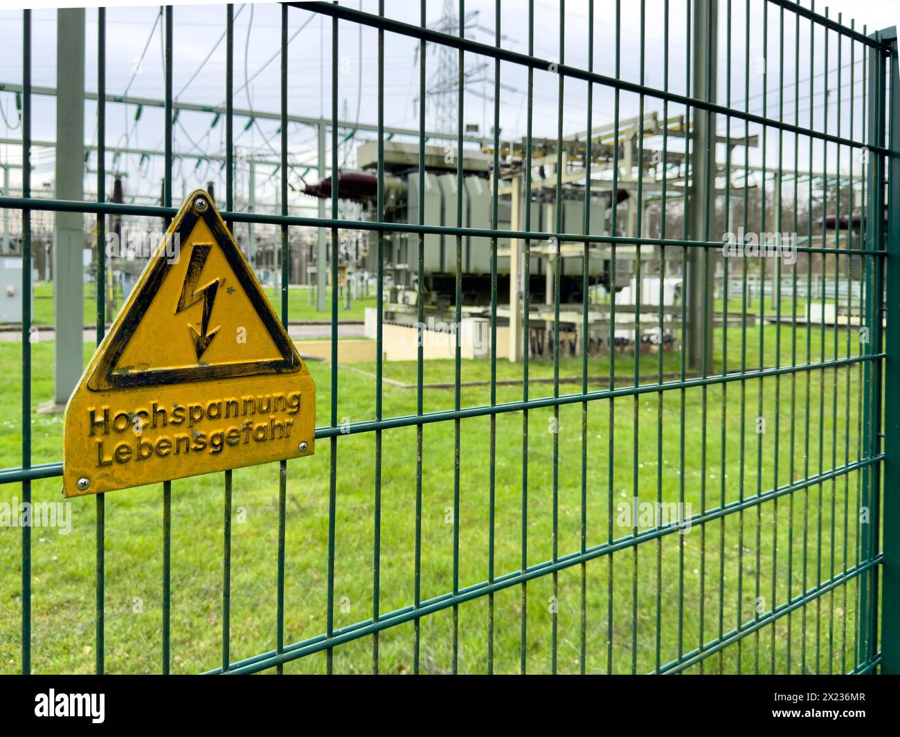 Warning sign Warning high voltage Danger to life on fence of substation ...