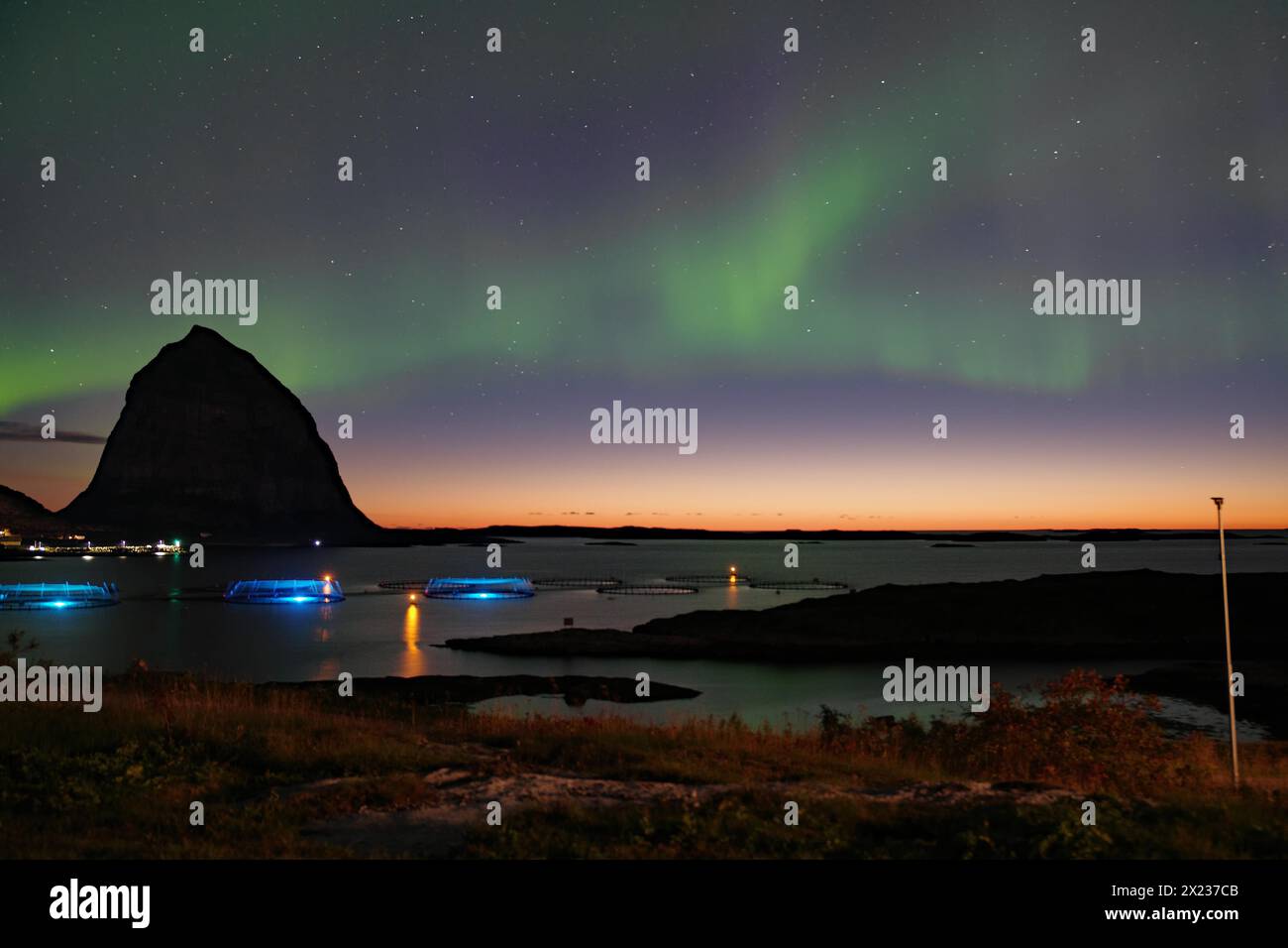 Northern lights (aurora borealis) mingle with sunset, sea, striking ...