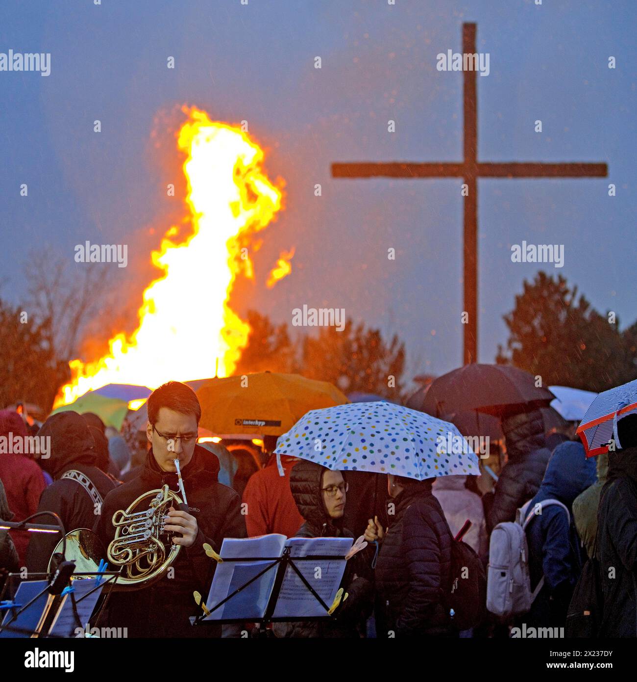 Musicians with a double horn in front of the Easter bonfire on the ...
