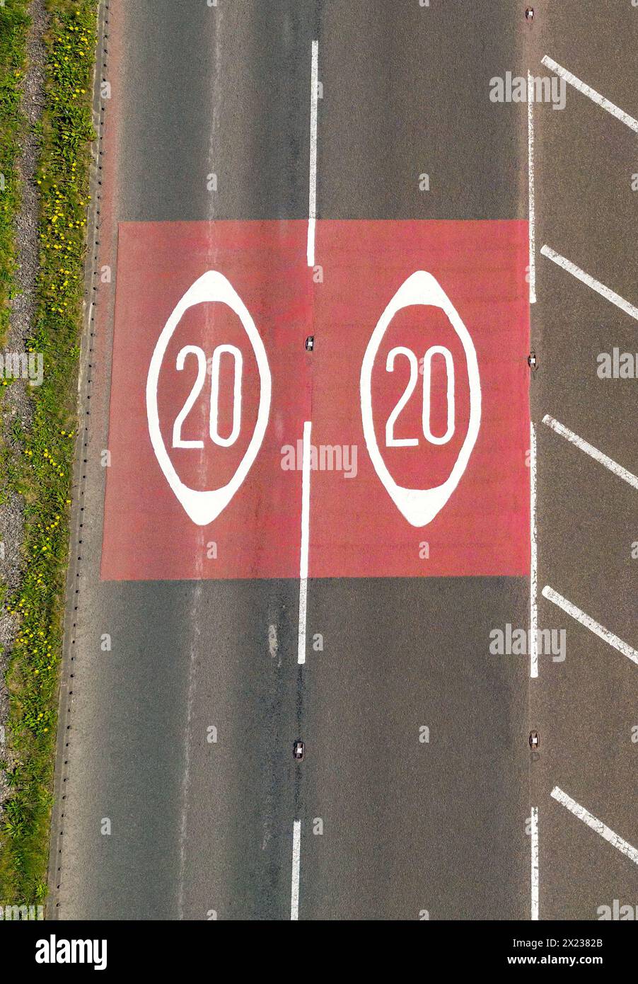 Drone view of road markings in Wales showing the start of a 20mph speed ...