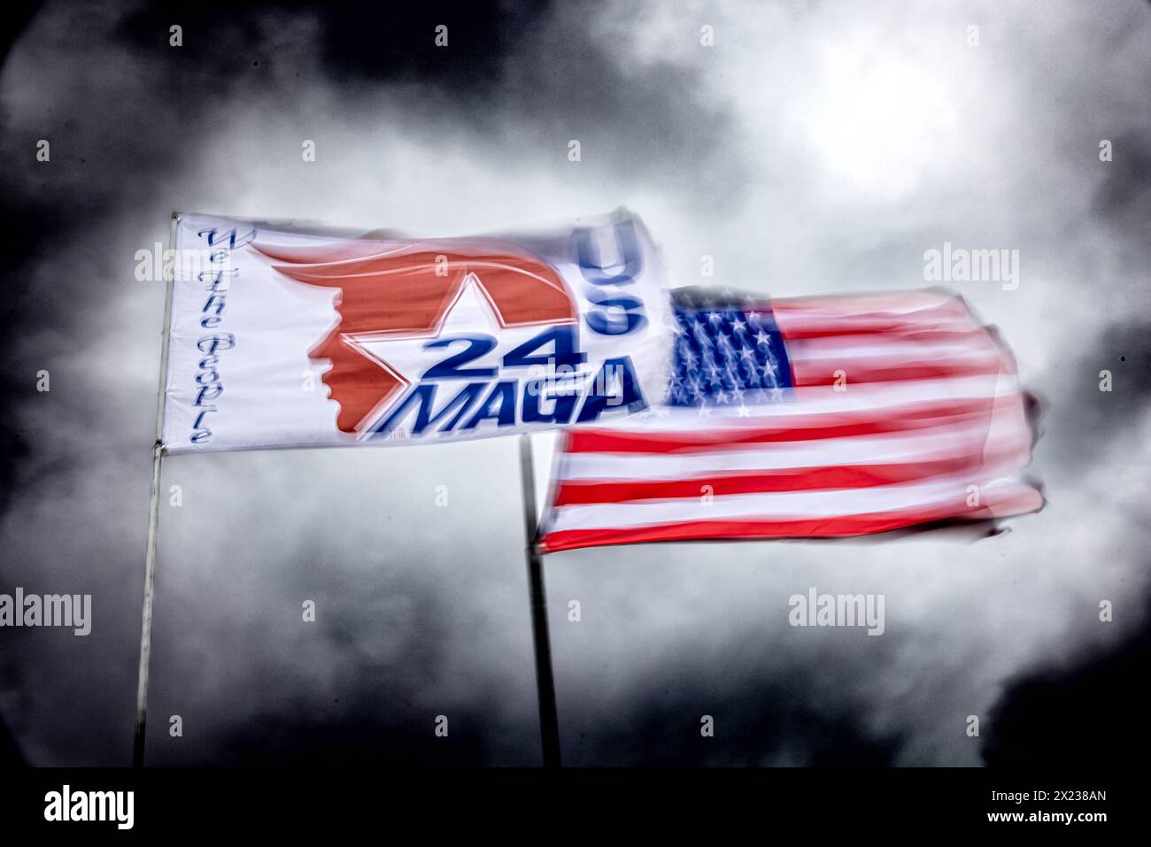 Brooklyn, United States. 13th Apr, 2024. Two flag billow in the wind as ...