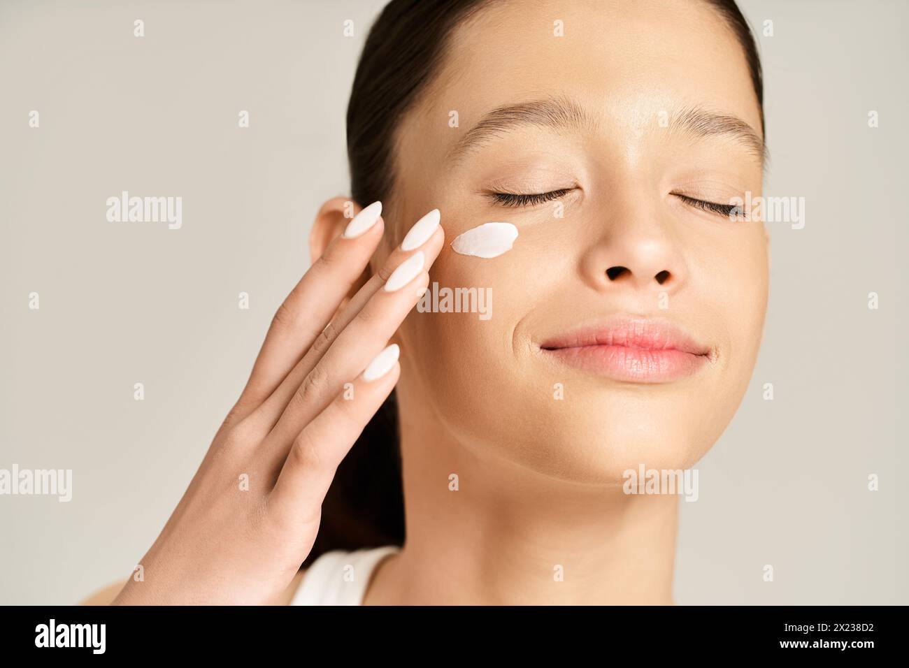 Teenage girl with eyes closed, wearing stylish vibrant attire, and a ...