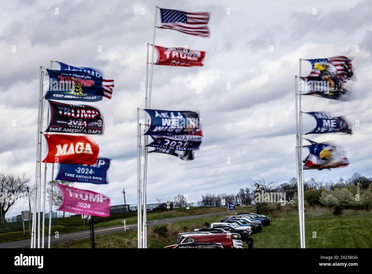Brooklyn, United States. 13th Apr, 2024. Two flag billow in the wind as ...