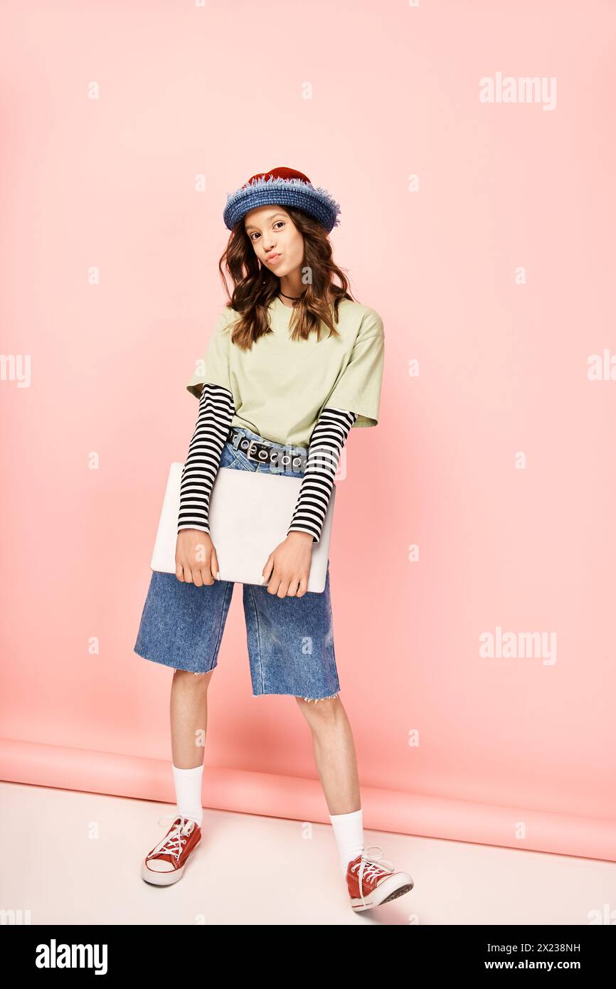 A stylish teenage girl, looking good in a green shirt and fashionable ...