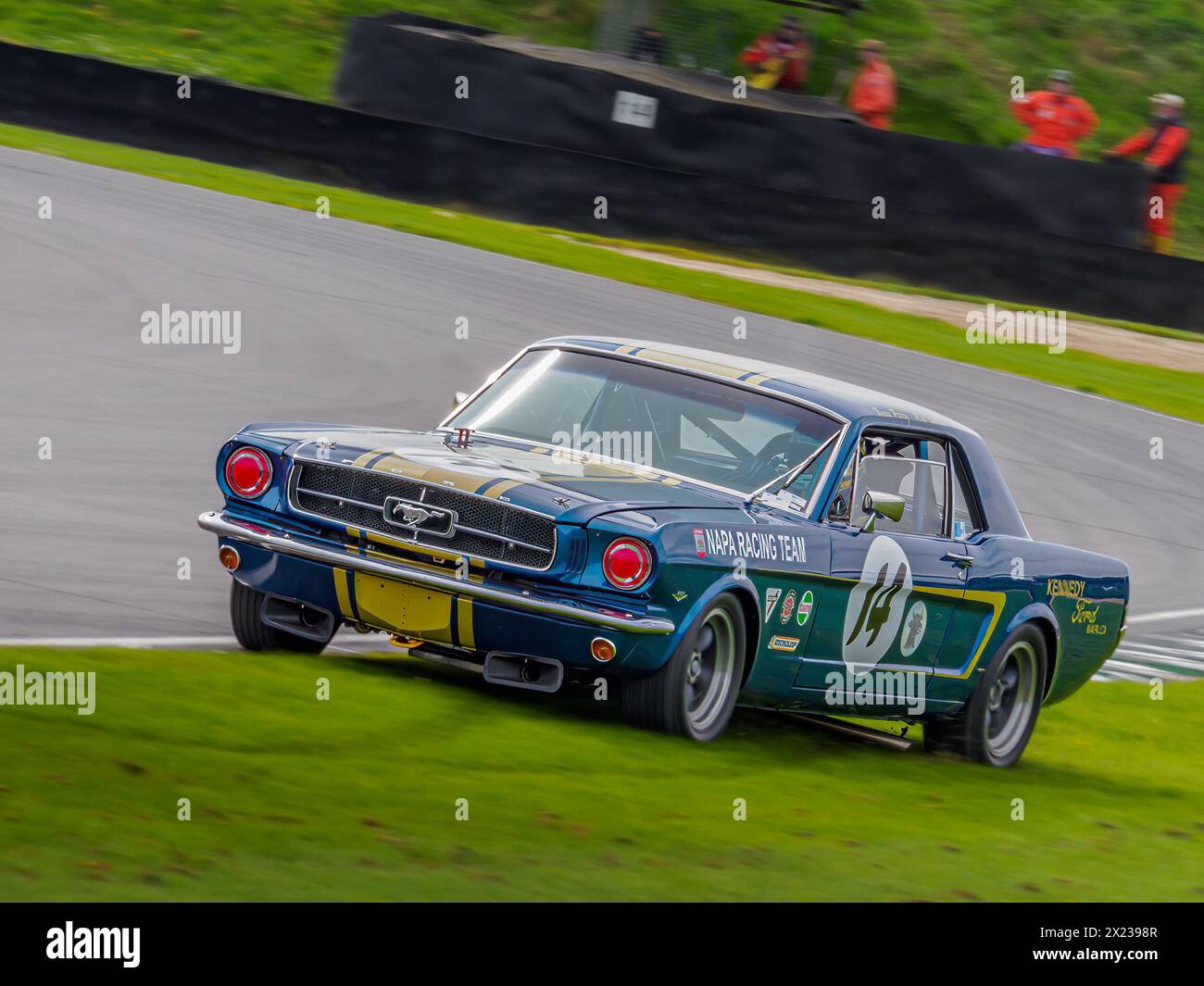 1965 Ford Mustang racing in the Ken Miles Cup going off track, Goodwood ...